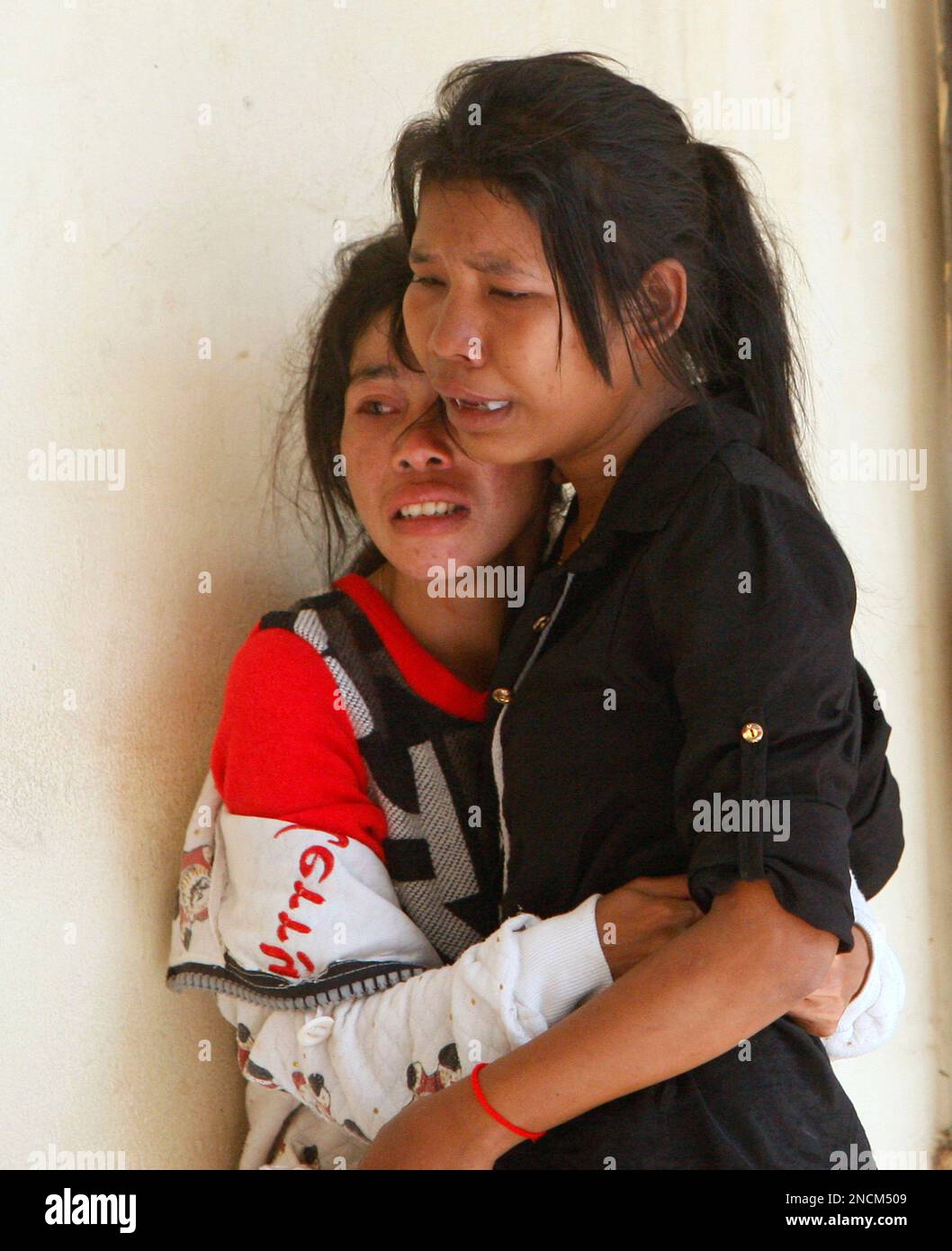 Relatives cry at Preah Kossamak Hospital where the bodies of stampede ...