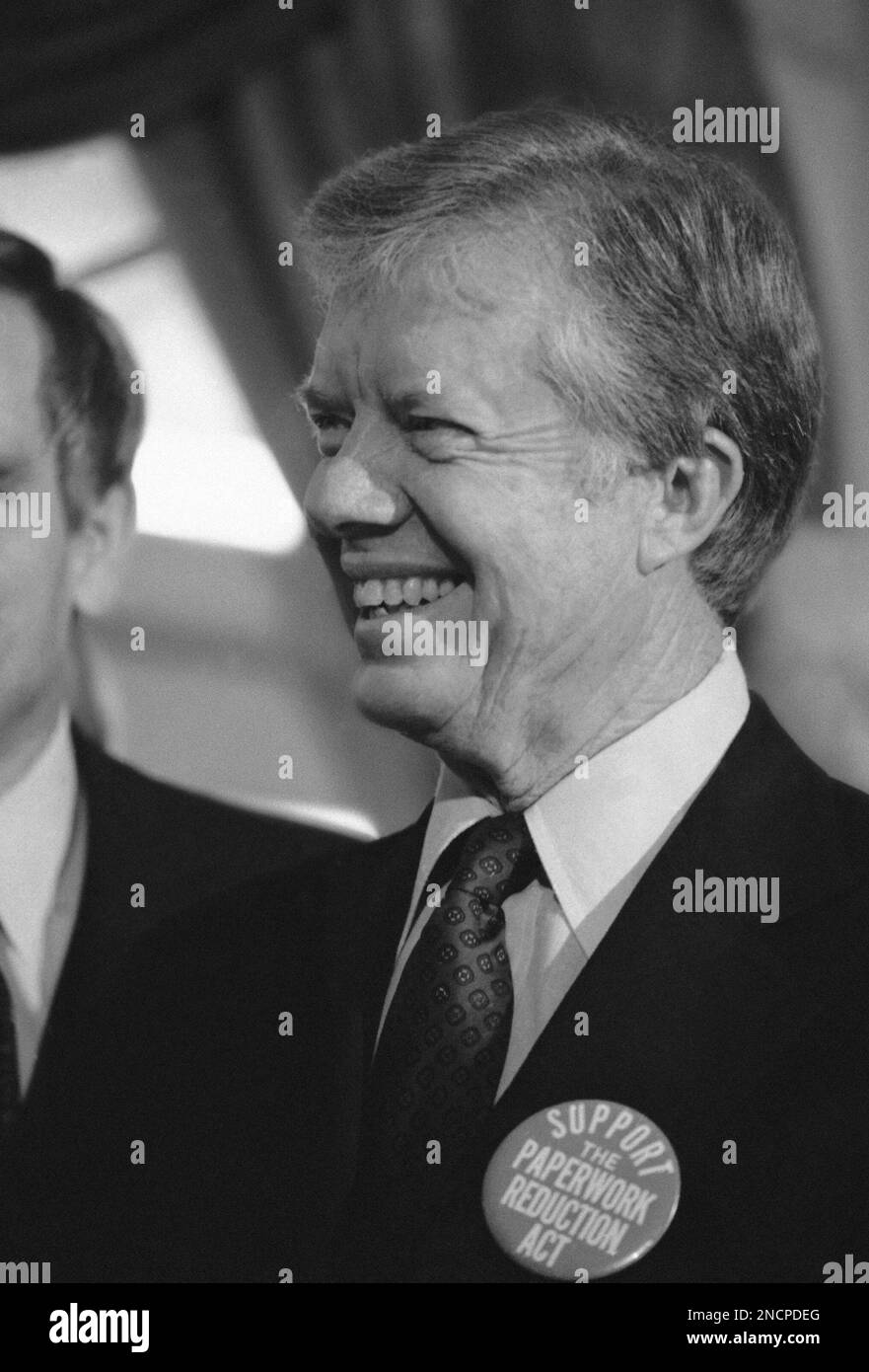 President Jimmy Carter wears a button reading “Support the Paperwork ...