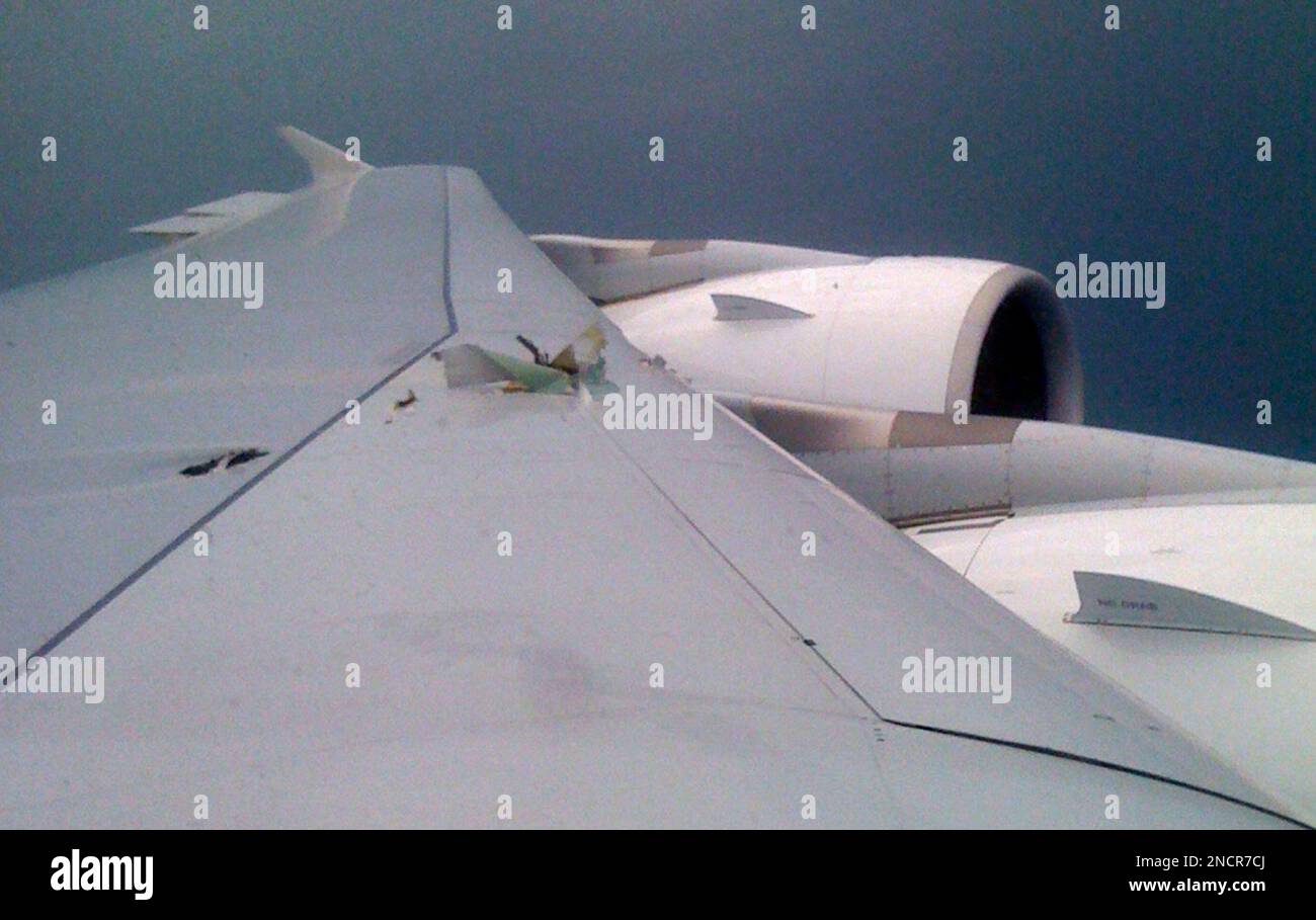 A damaged part of the left wing of a Qantas Airbus A380 is seen through ...