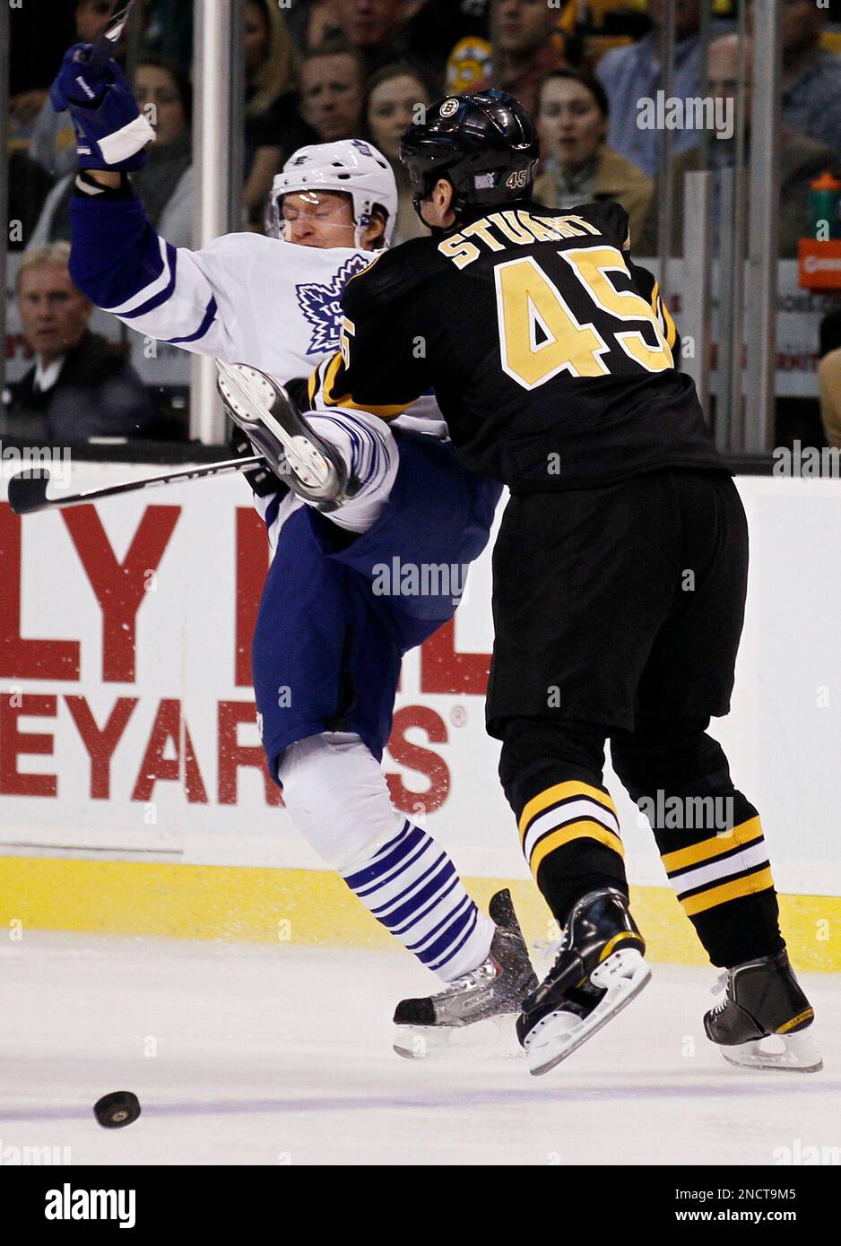 Boston Bruins defenseman Mark Stuart (45) hits Toronto Maple Leafs left ...