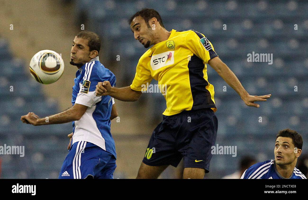 Saudi's Al-Hilal player Abdulatif Al-Ghanam, left, vies for the ball ...