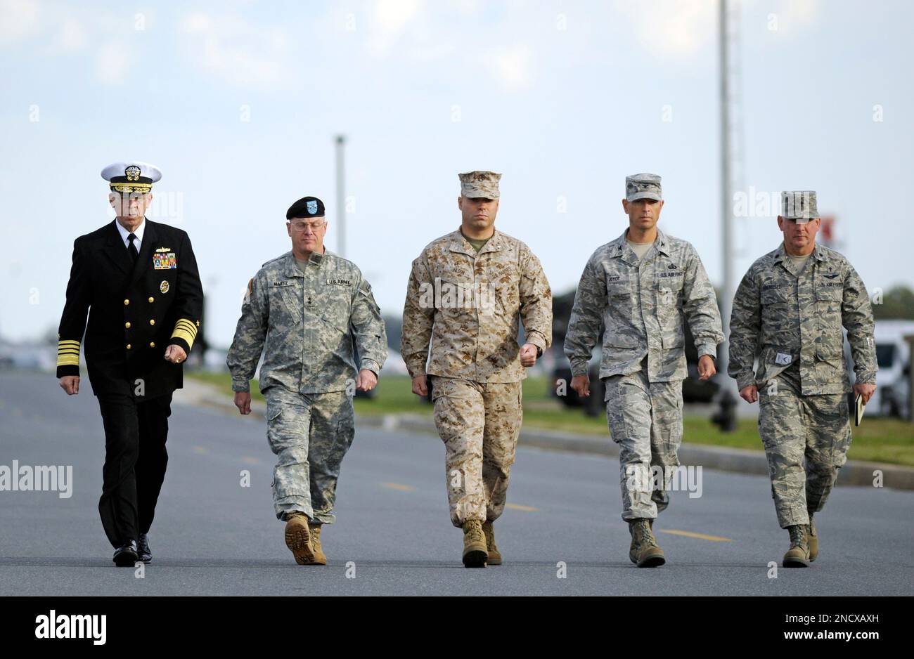 Adm. Michael Mullen, Chairman of the Joint Chiefs of Staff, left, walks ...