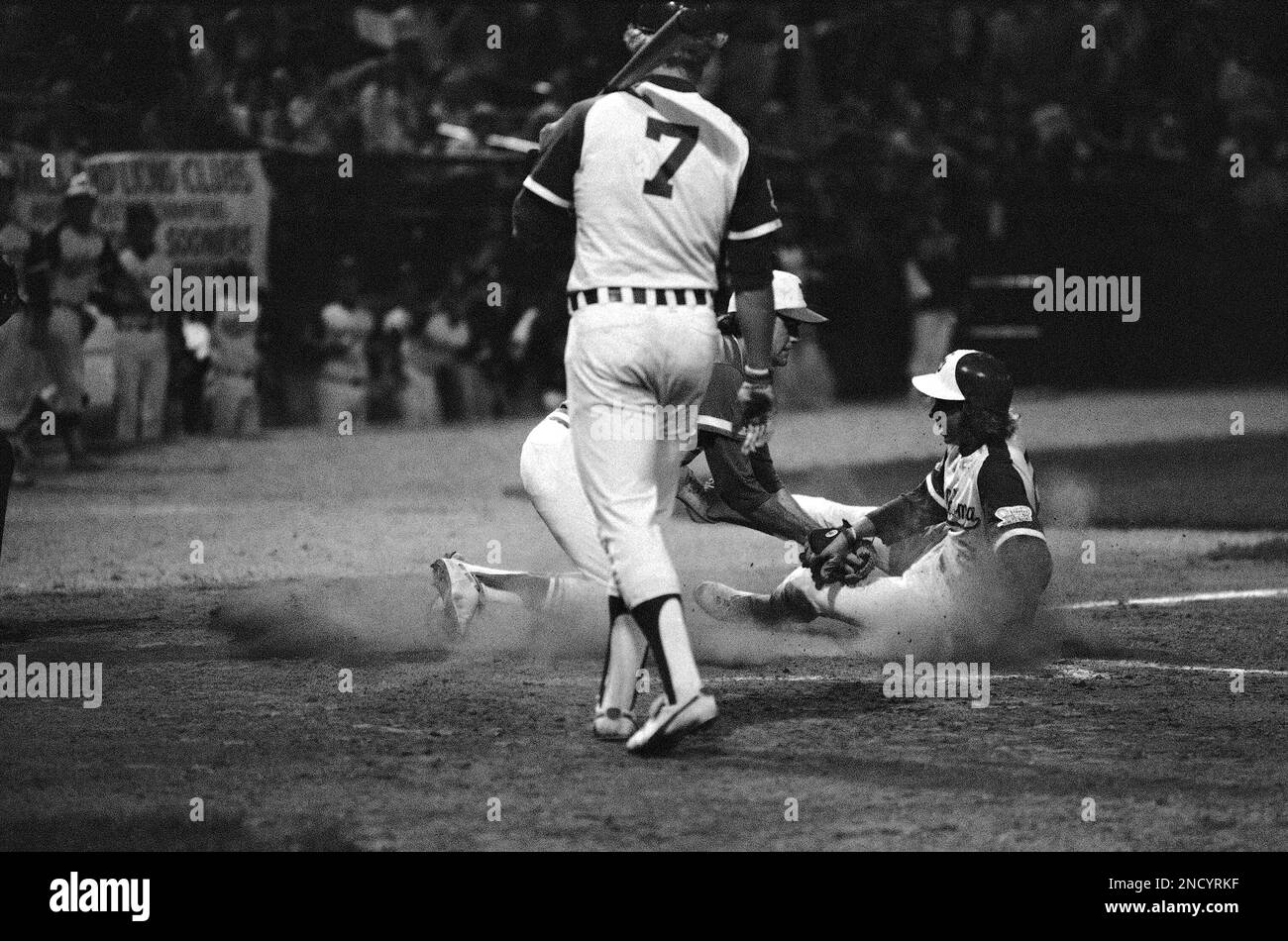 University of Texas pitcher Jim Gideon puts the tag on Keith Drumwright ...