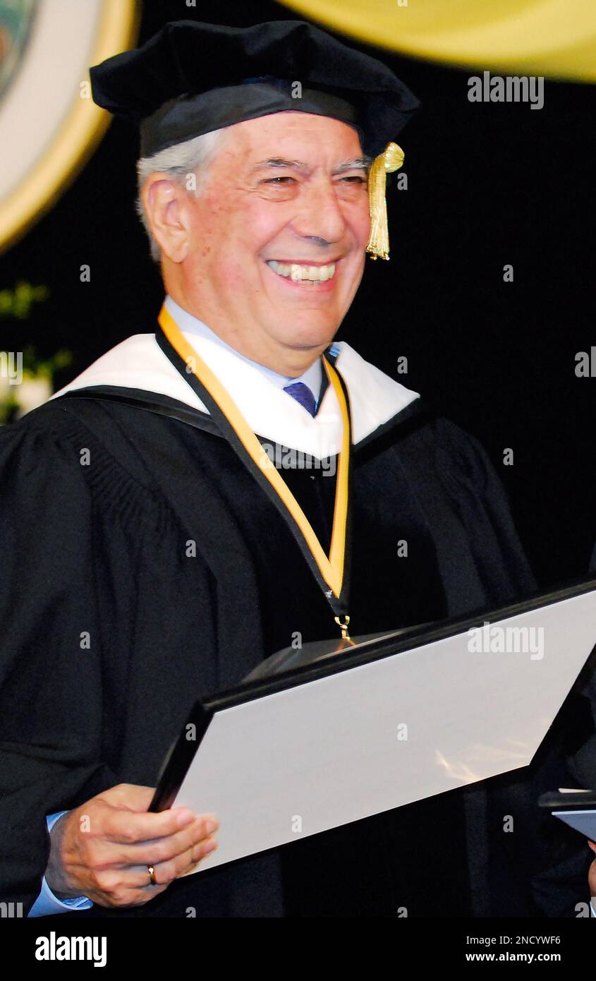 FILE - Peruvian writer Mario Vargas Llosa laughs after receiving a ...