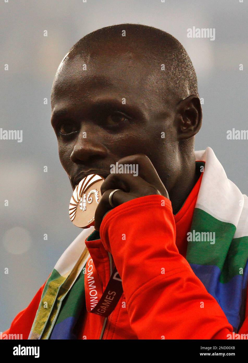 Kenya's Mark Kiptoo poses with his bronze medal for the Men's 5000m ...