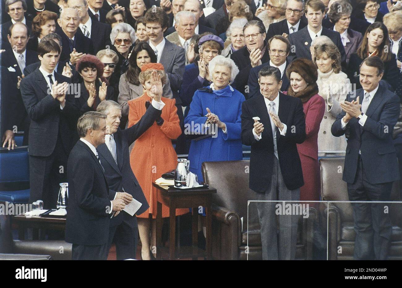 Outgoing President Jimmy Carter, second from right, waves farewell at ...