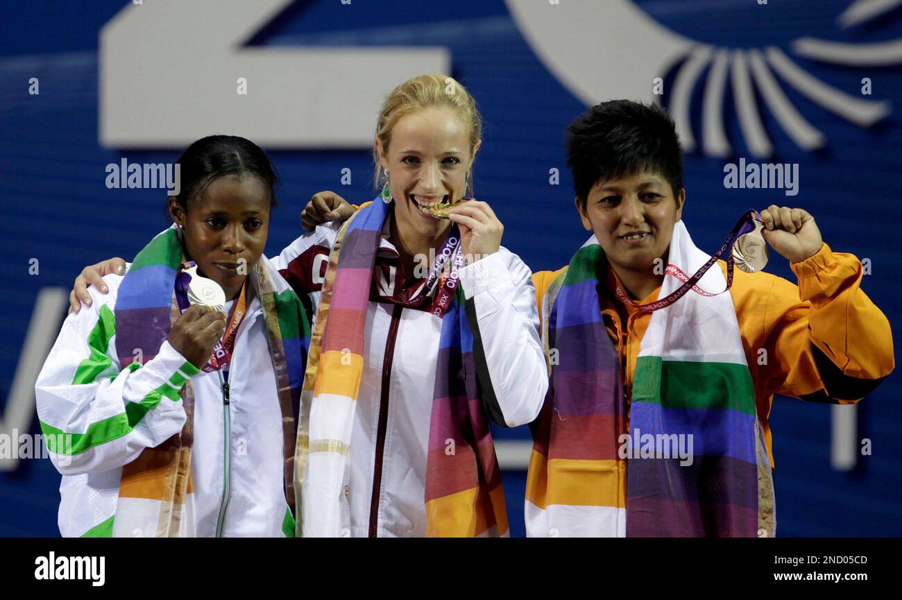 From left, Nigeria's Onyeke Azike, silver, Canada's gold medalist ...