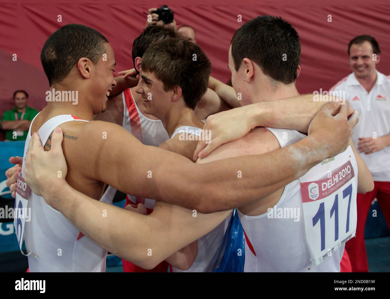 England's Max Whitlock, center, celeberates with Steve Jehu, Reiss ...