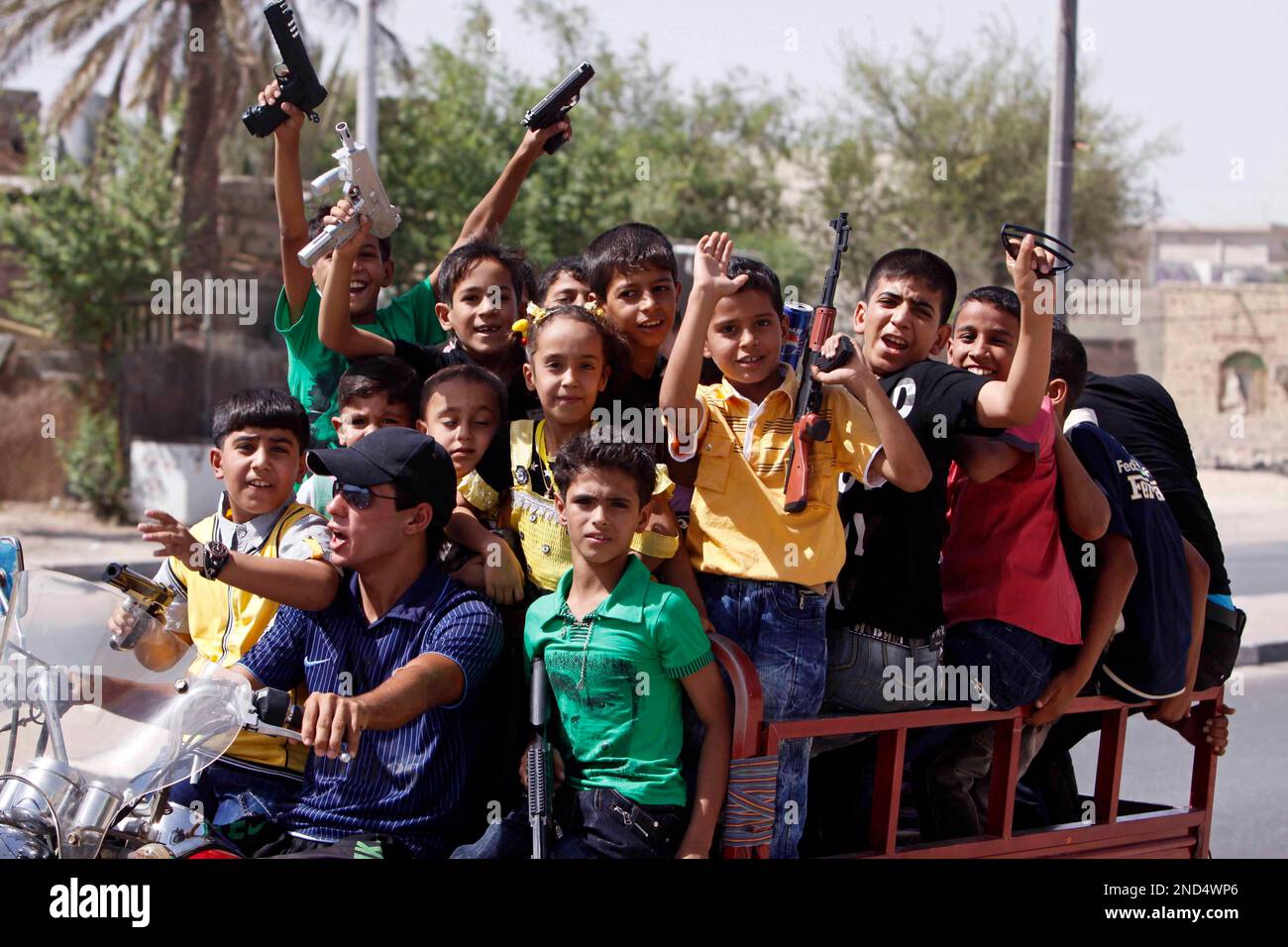 Iraqi children play during an Eid holiday celebration in Basra ...