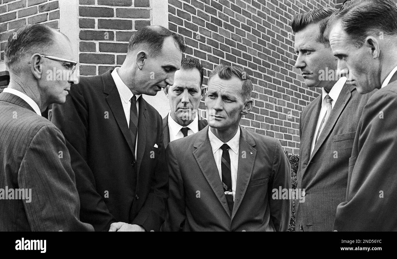 Ku Klux Klansmen from several states talk quietly outside the funeral ...