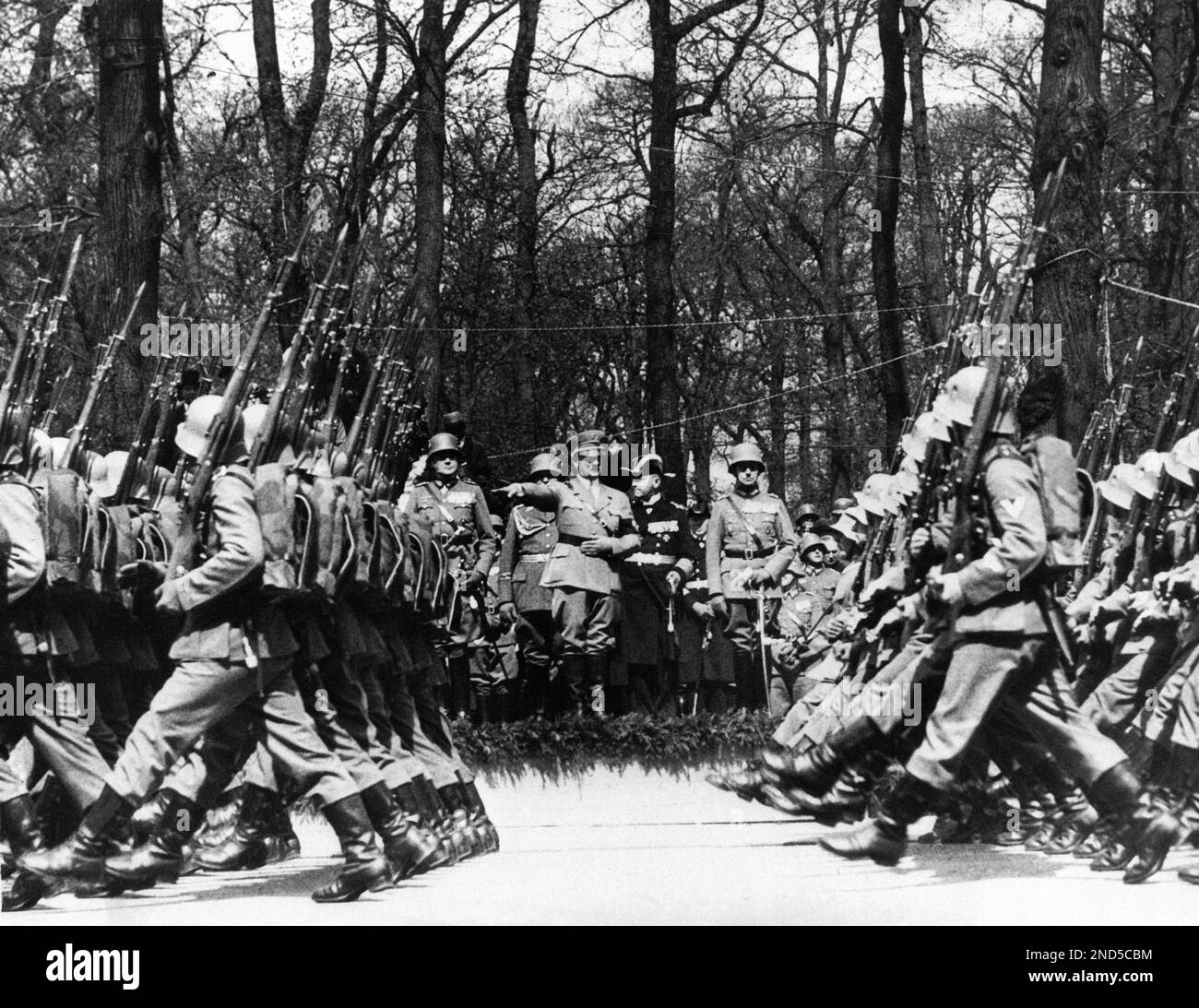 Germany’s dictator, Adolf Hitler, responds with the Nazi salute as ...