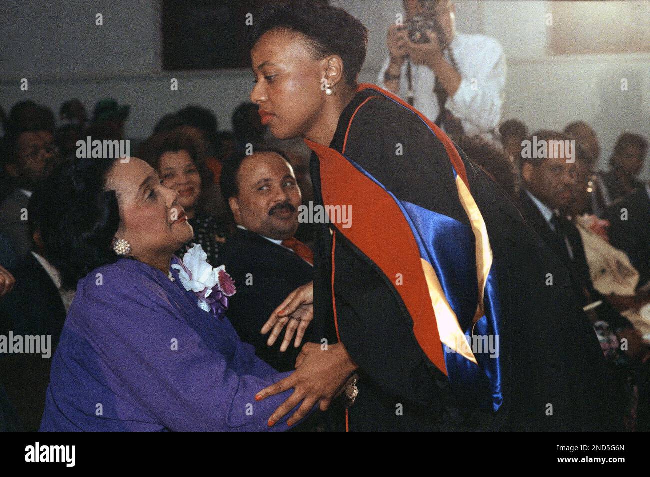 Coretta Scott King, left, gives a hug to her youngest daughter Bernice ...