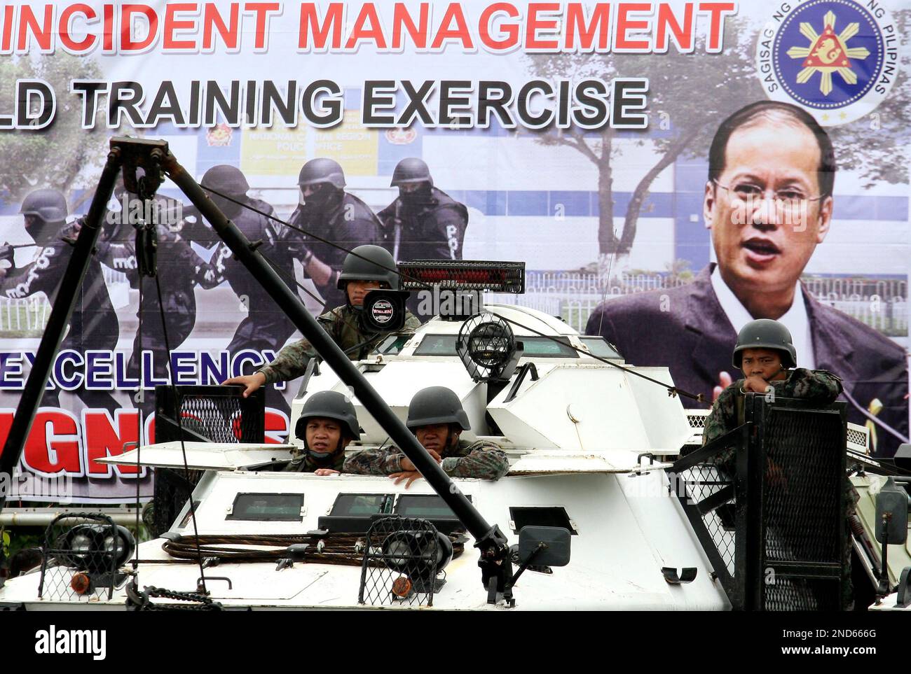 Philippine National Police officers watch from their Armored Personnel ...