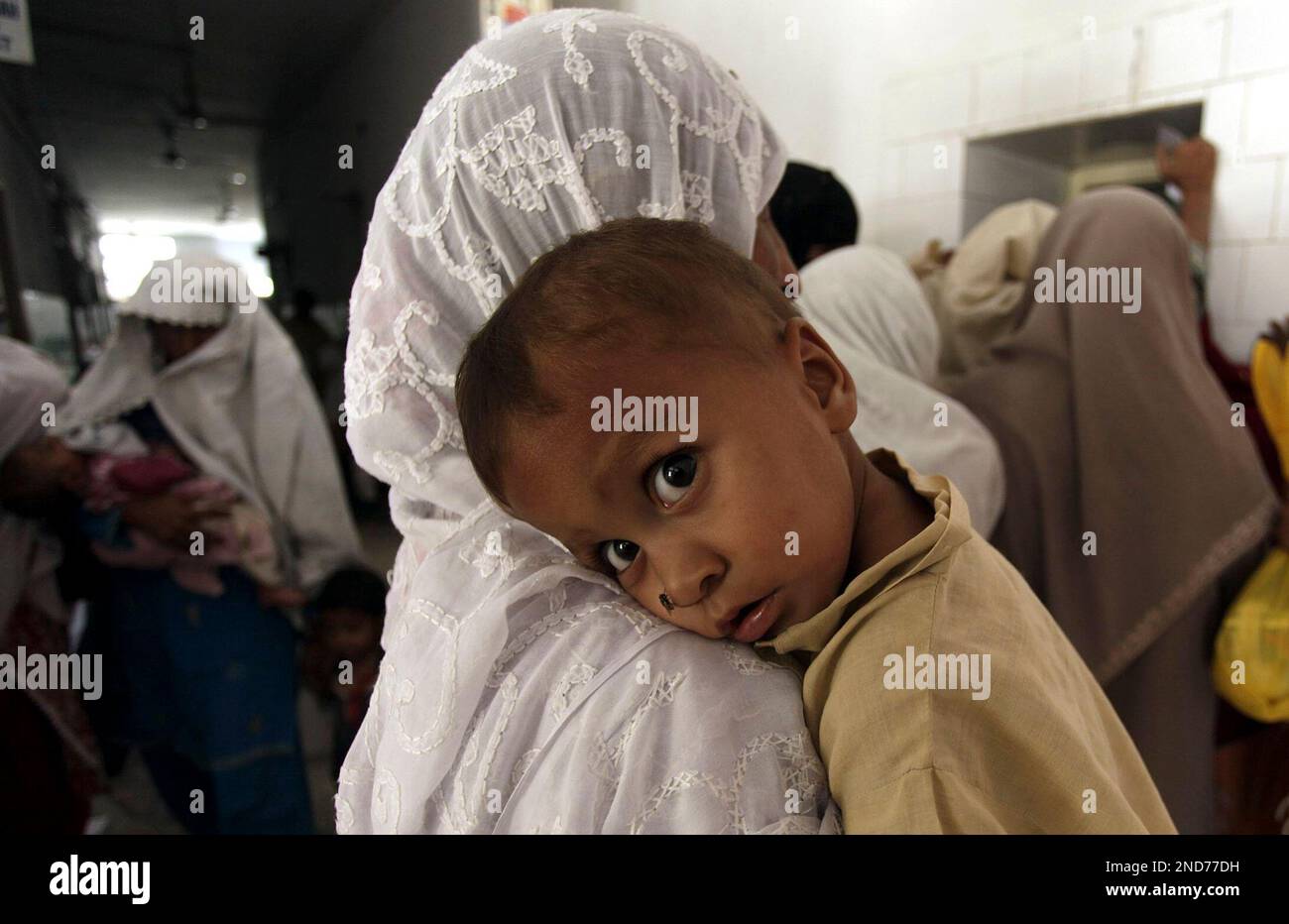 In this photo taken on Aug 27, 2010, Pakistani flood survivors wait for ...