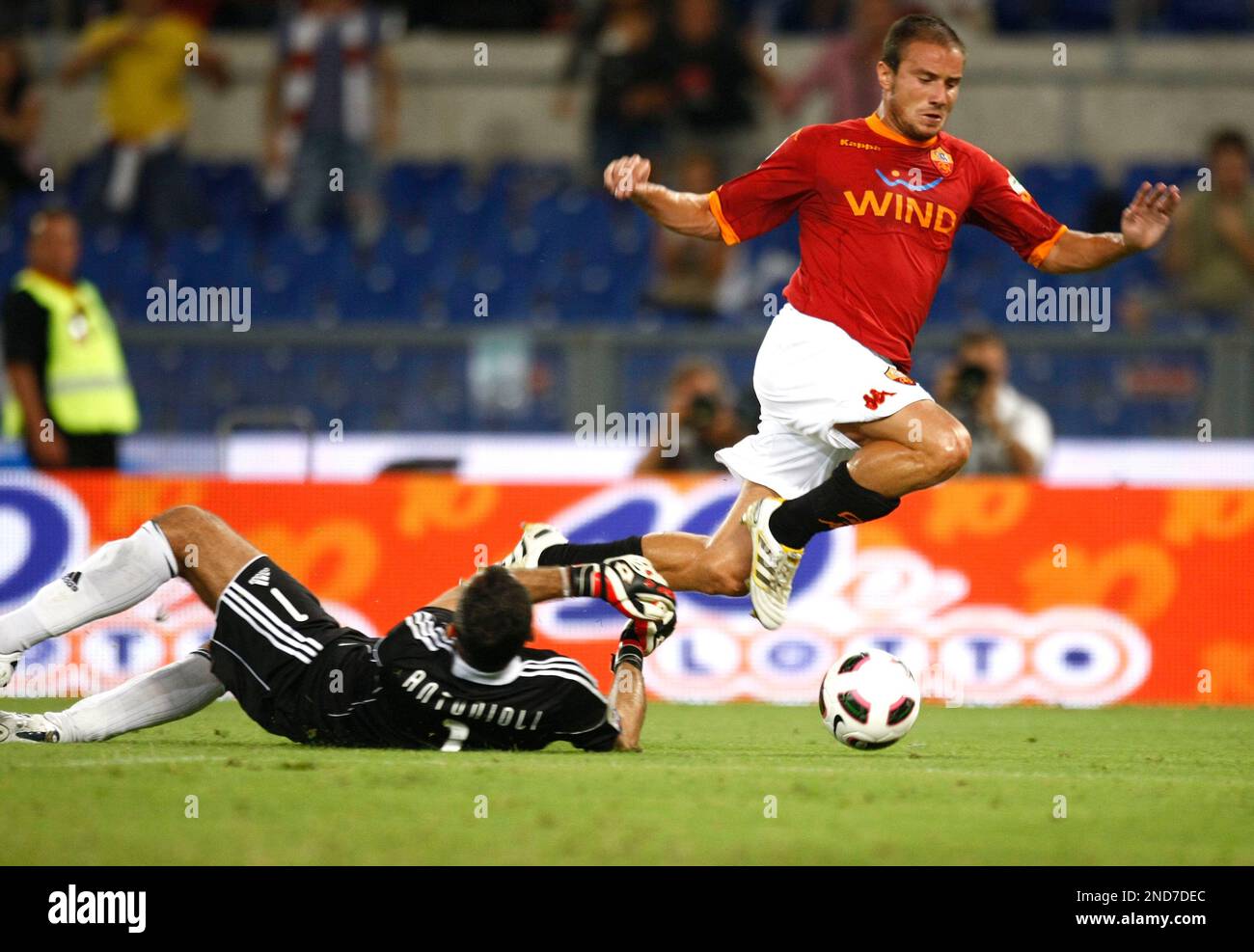 Cesena goalkeeper Francesco Antonioli stops AS Roma midfielder Matteo ...