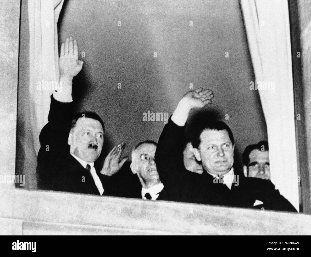 Adolf Hitler giving the fascist salute to crowds cheering him in Berlin ...