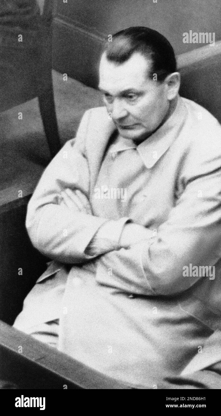 Hermann Goering wears a plain tunic as he sits in the prisoners dock at ...