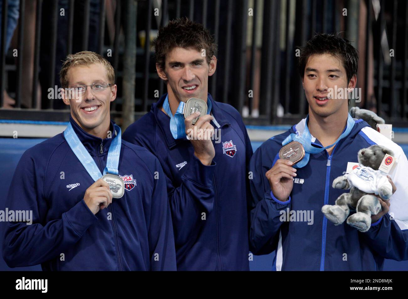 From left, silver medalist Tyler McGill, gold medalist Michael Phelps ...