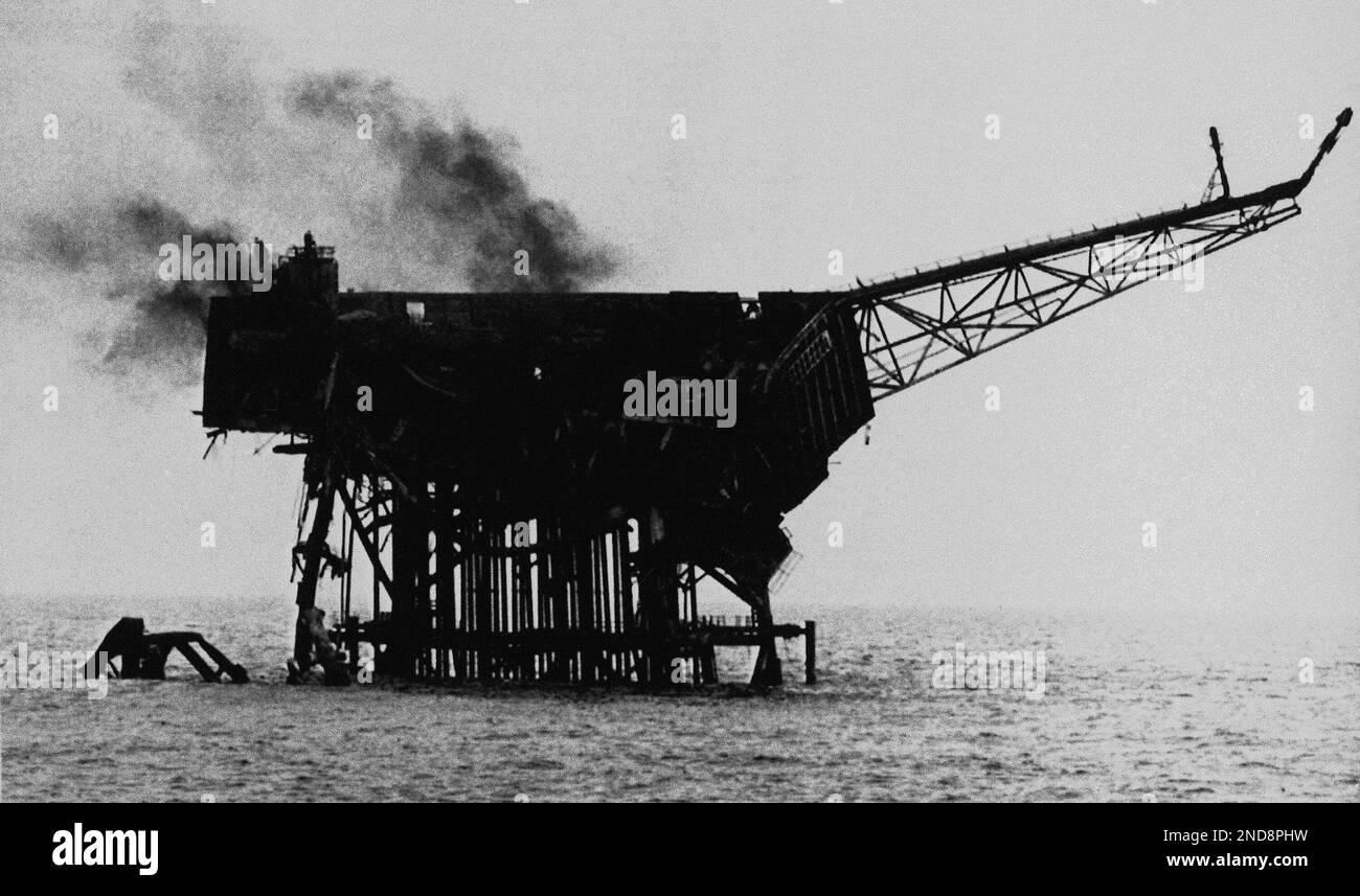 Smoke rises from the burnt out shell of the Piper Alpha oil platform in ...