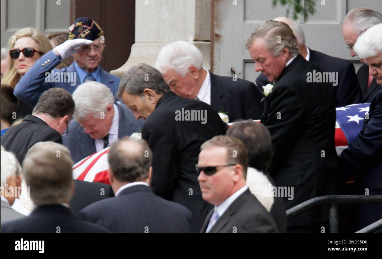Pall bearers carry the casket of former U.S. Rep. Dan Rostenkowski out ...