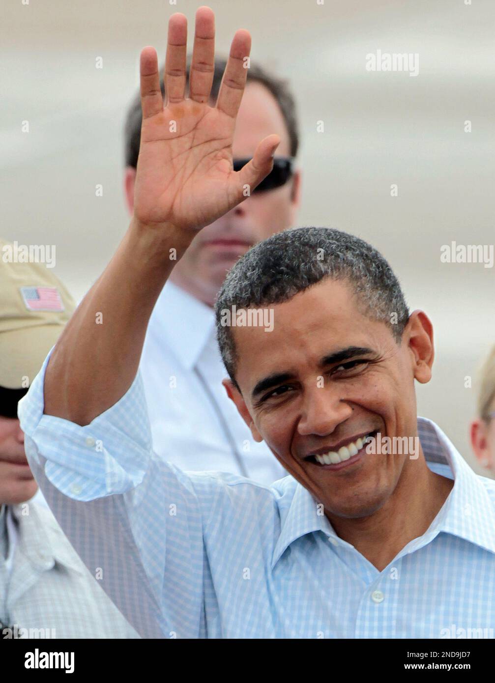 President Barack Obama waves after arriving at Tyndall Air Force Base ...