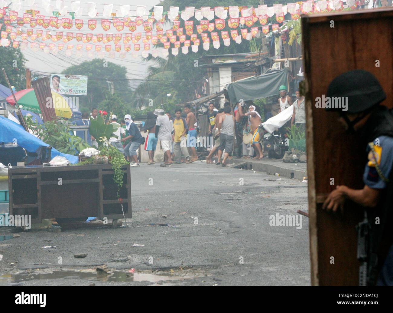 Residents battle with police during demolition of a poor neighborhood ...
