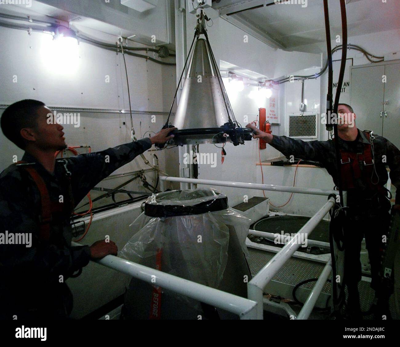 FILE - In this April 15, 1997 picture, Senior Airmen Mark Pacis, left, and Christopher Carver ...