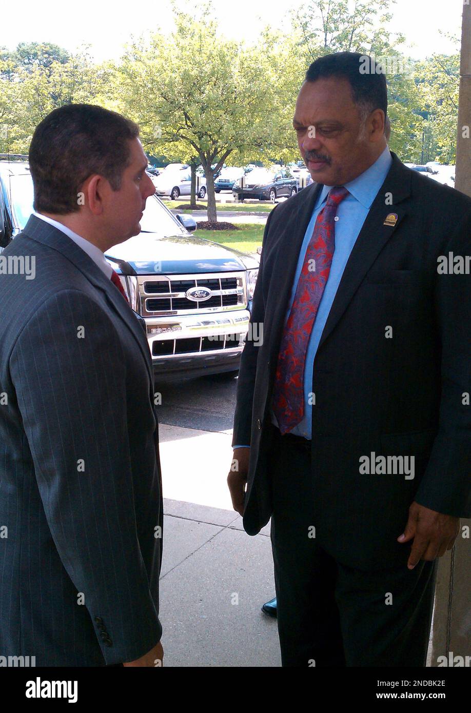 The Rev. Jesse Jackson, right, talks with Lansing Mayor and Democratic ...