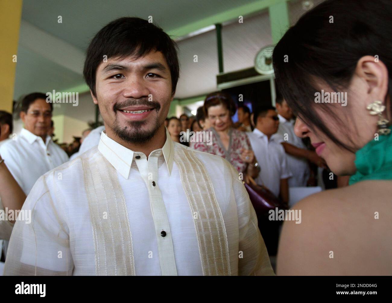 Filipino boxer Manny Pacquiao, an army reservist, smiles as he attends ...
