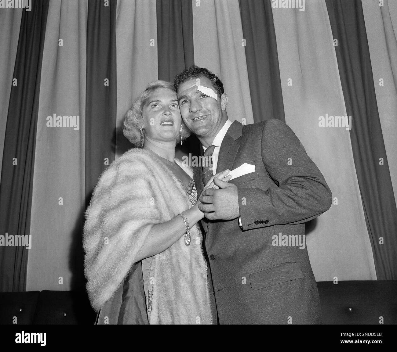 A patch covers a gash over Rocky Marciano’s left eye but the world ...