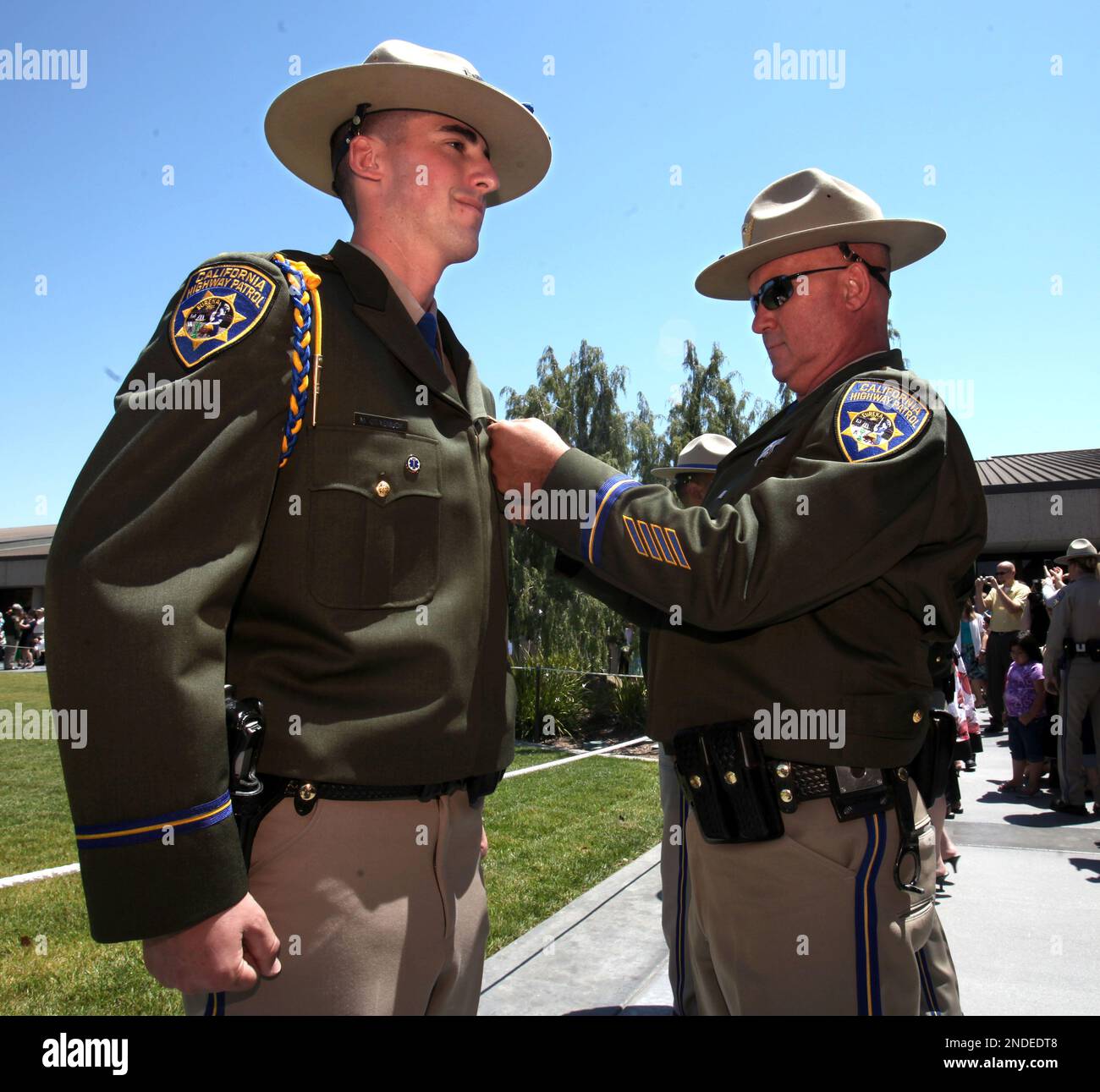 California Highway Patrol Cadet Mathew Grasmuck, left, has his CHP ...