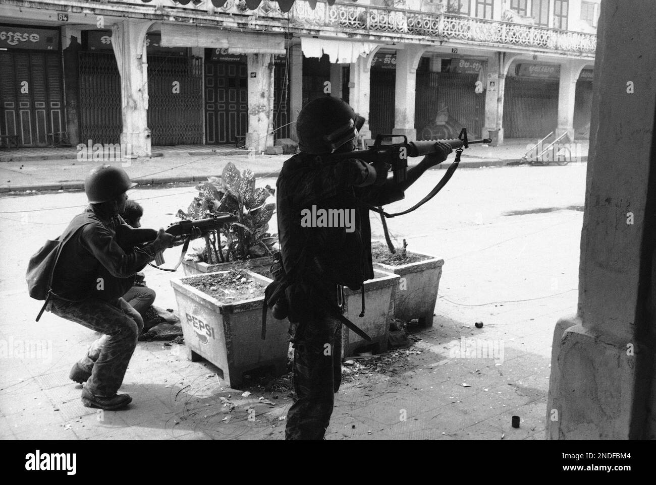 Cambodian government soldiers, using rifles and grenade-launchers, fire ...