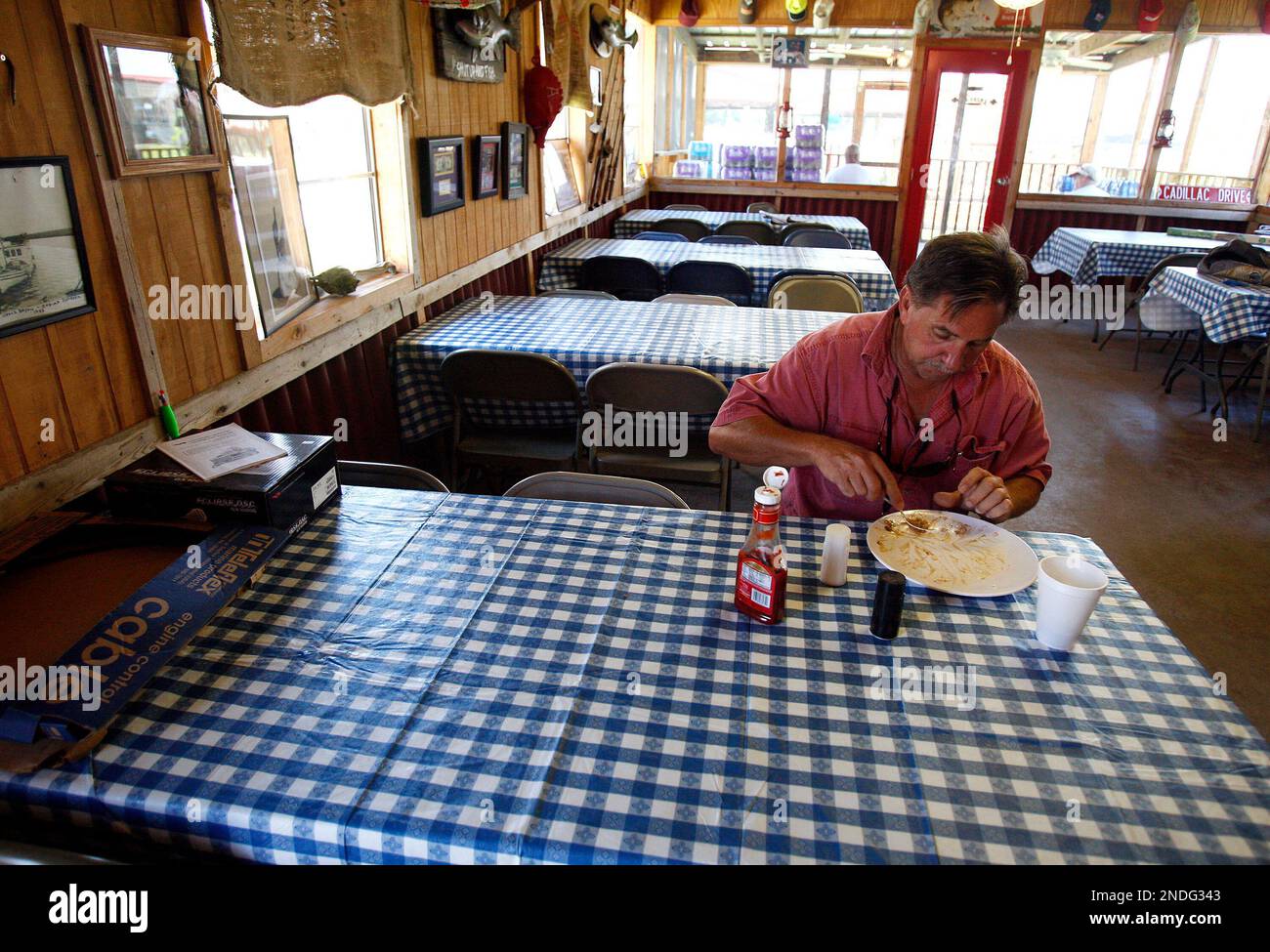 In this June 26, 2010 picture, business owner Raymond Griffin eats ...