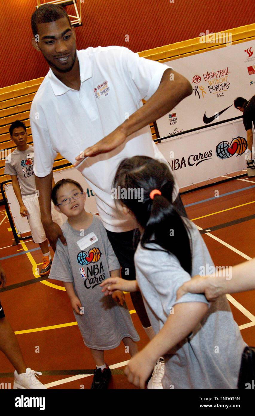 Corey Brewer of the Minnesota Timberwolves, center, is seen with ...