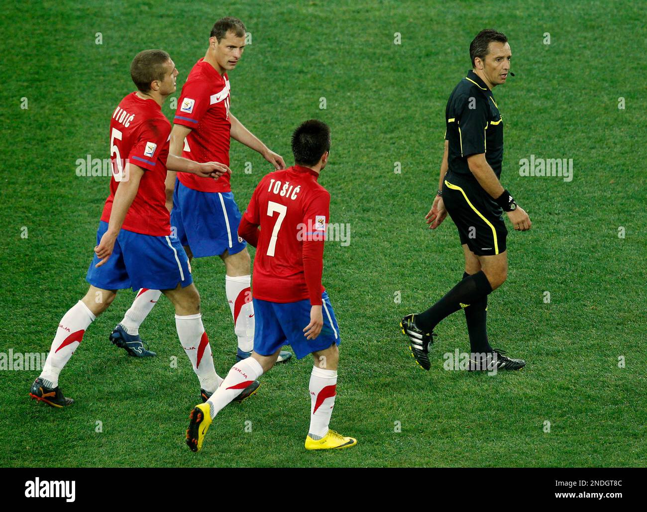 Serbia's Nemanja Vidic, left, Serbia's Milan Jovanovic, second from ...