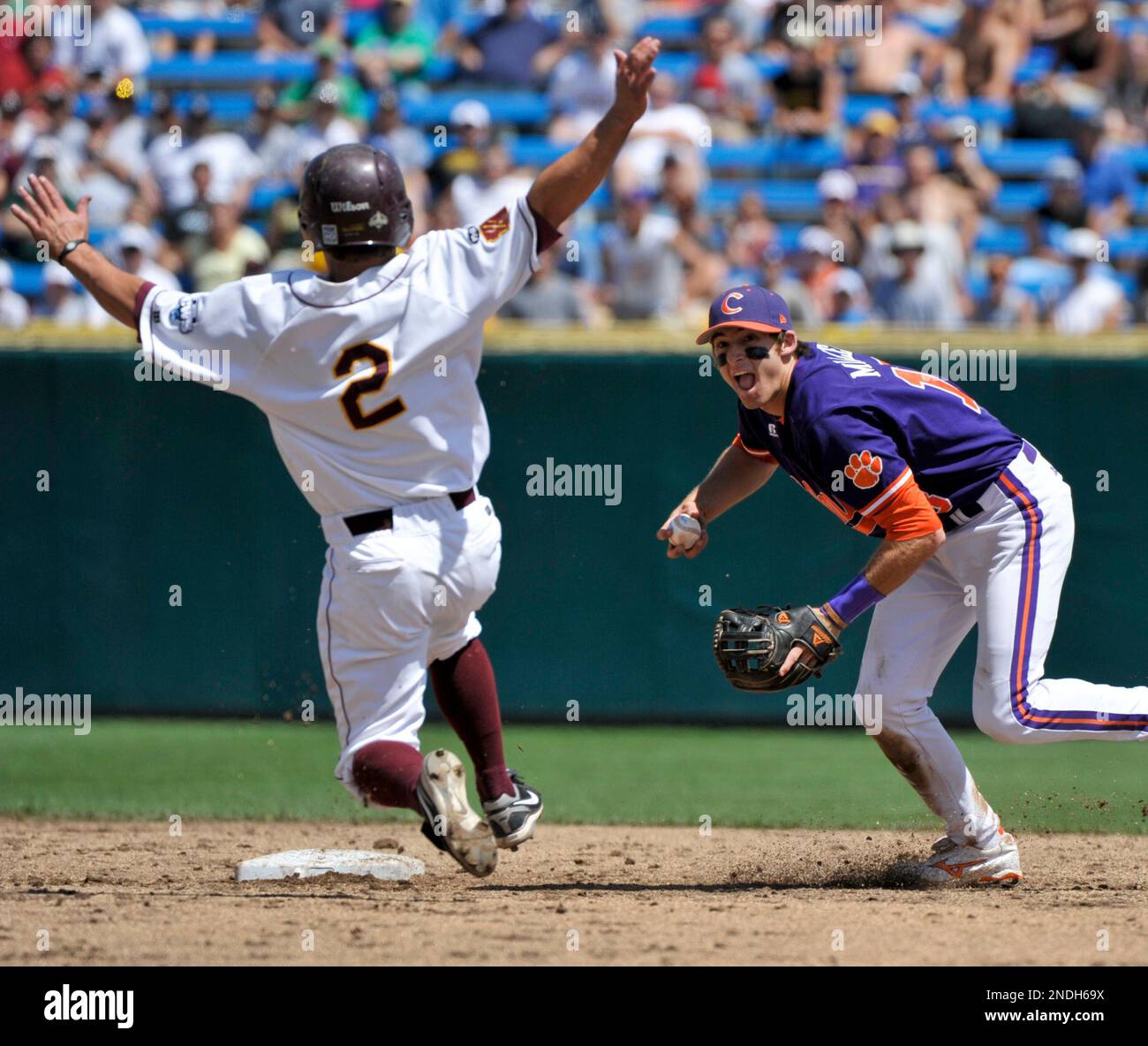 Clemson short stop Brad Miller prepares to throw to first base after ...