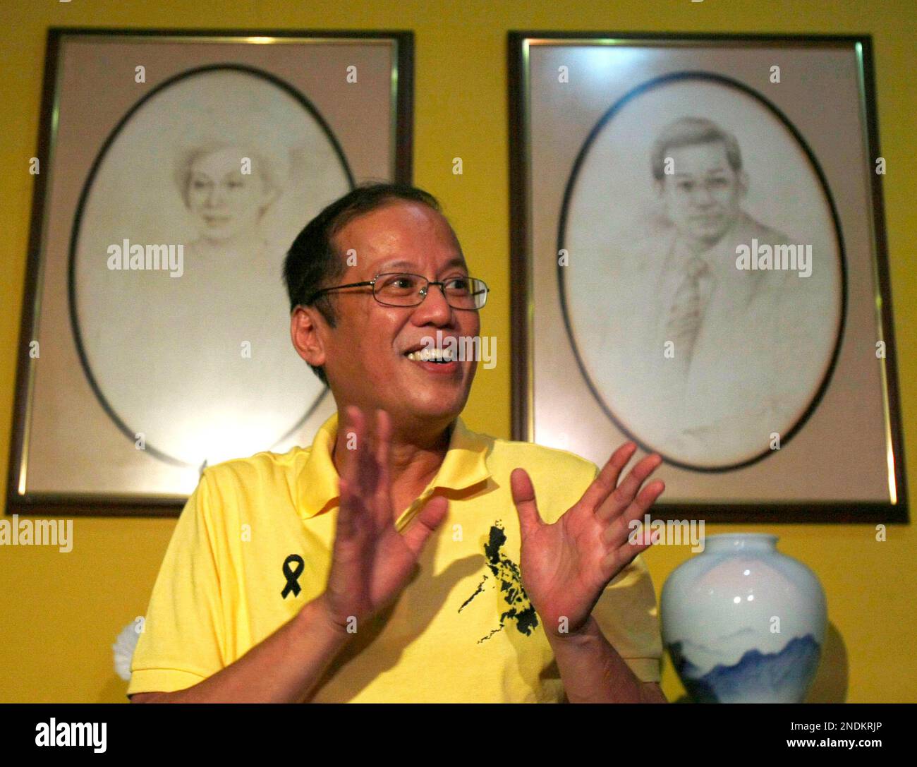 President-apparent Sen. Benigno "Noynoy" Aquino III, gestures during a news conference at his ...