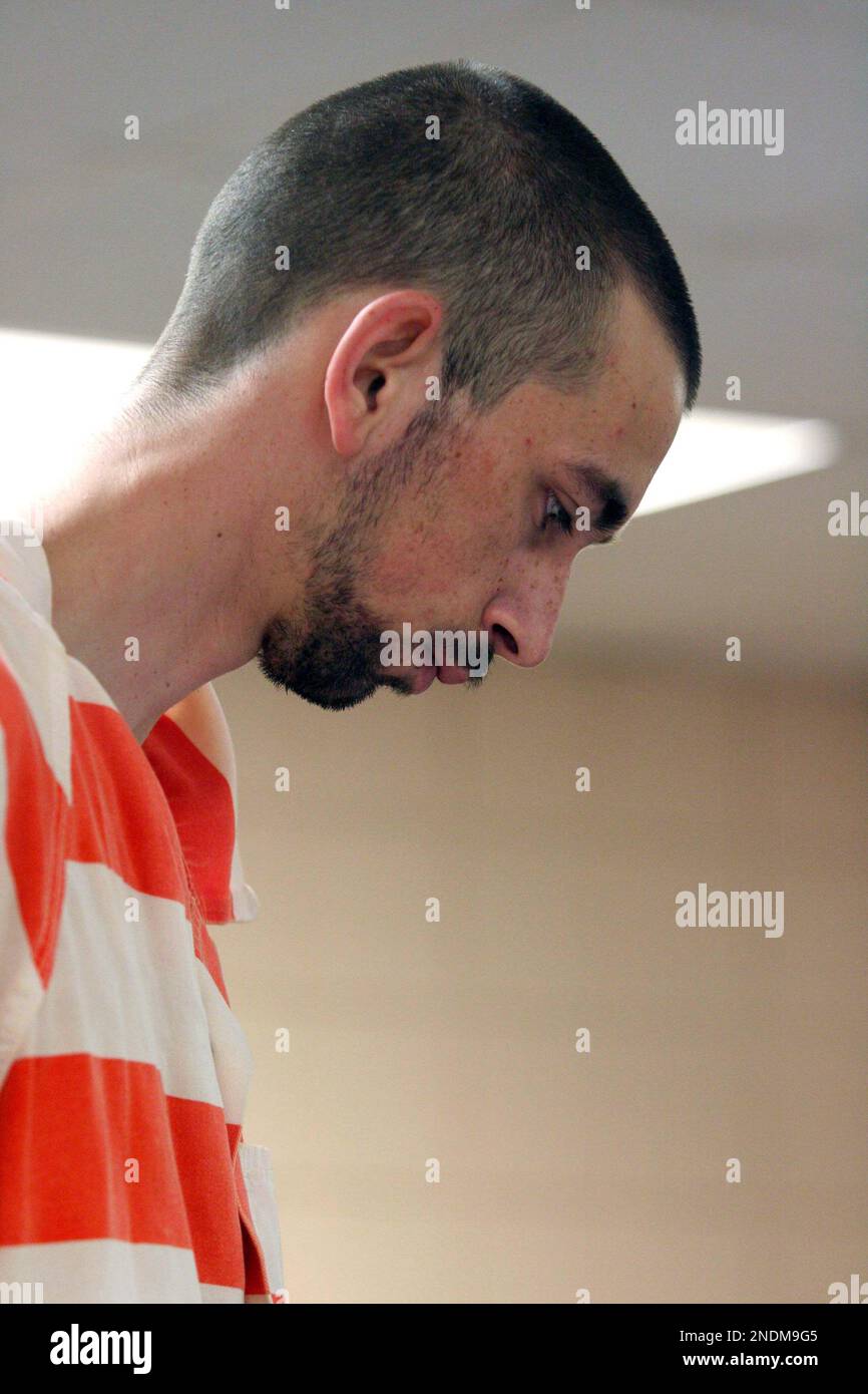 Gregory Collins, 19, bows his head at his first appearance in front of a magistrate to face ...