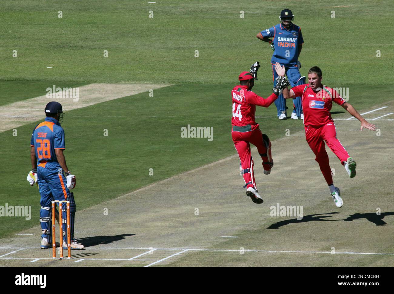 Zimbabwean players Tatenda Taibu and Raymond Price, right, celebrate ...