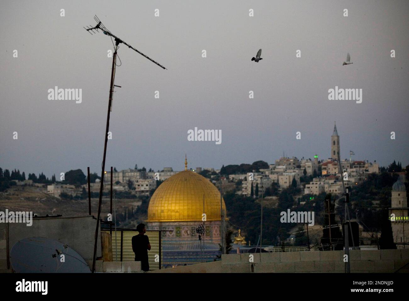 Back dropped by the Dome of the Rock Mosque, in the Al Aqsa Mosque ...