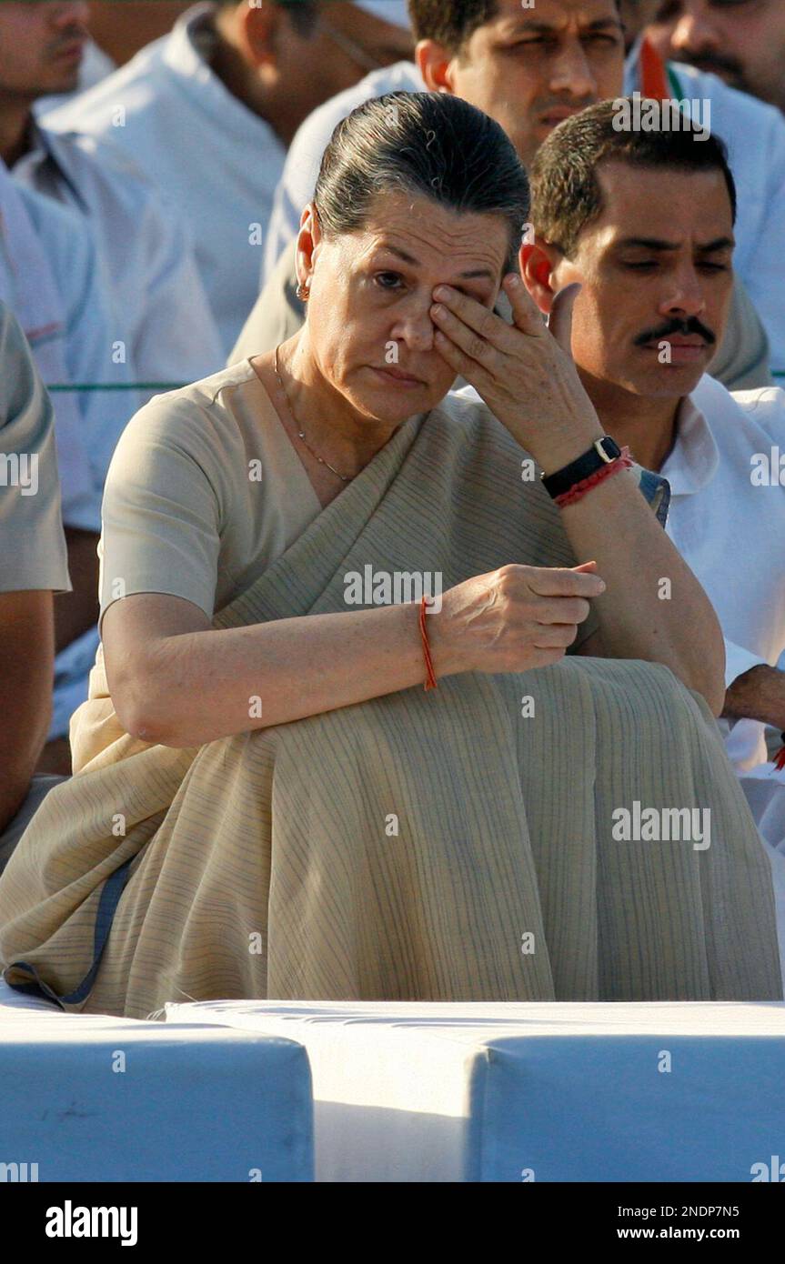 India's ruling Congress party president Sonia Gandhi, center, gestures ...