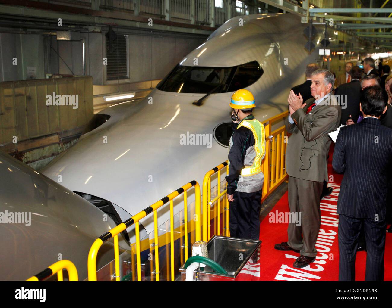 U.S. Transportation Secretary Ray LaHood, applauds as two types of ...