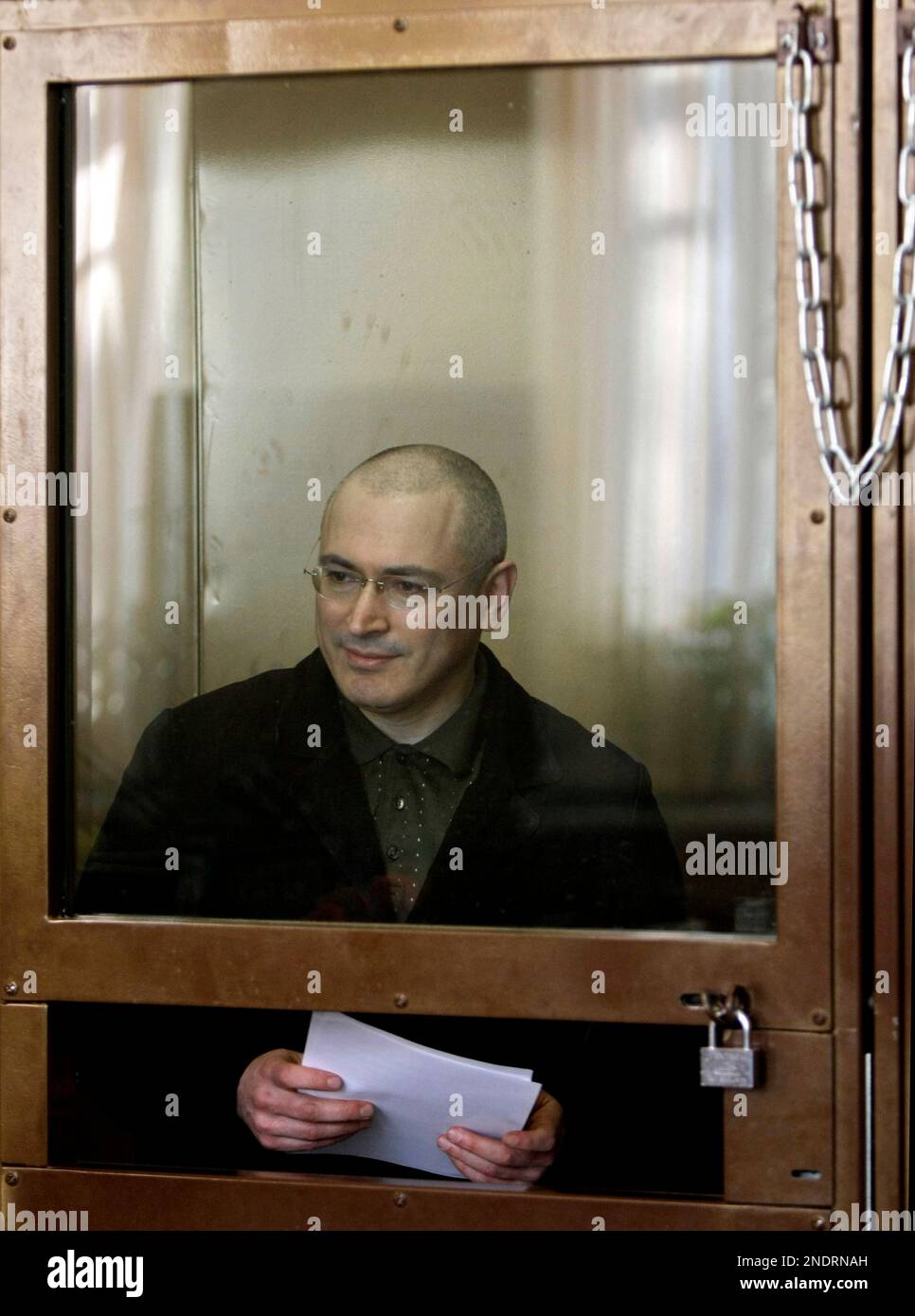 Former Yukos CEO Mikhail Khodorkovsky Is In A Court Room Behind A Glass