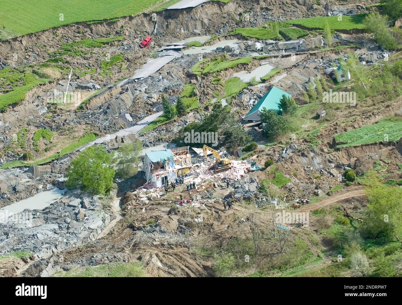 Rescuers work at the scene of a landslide in Saint-Jude, Quebec as ...