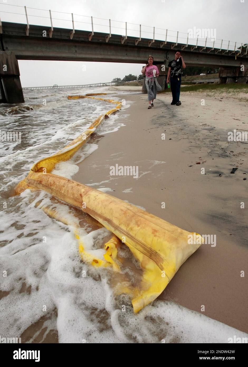Tammy Daughdrill, left, and Joey Scalcione of Long Beach, Miss., walk ...