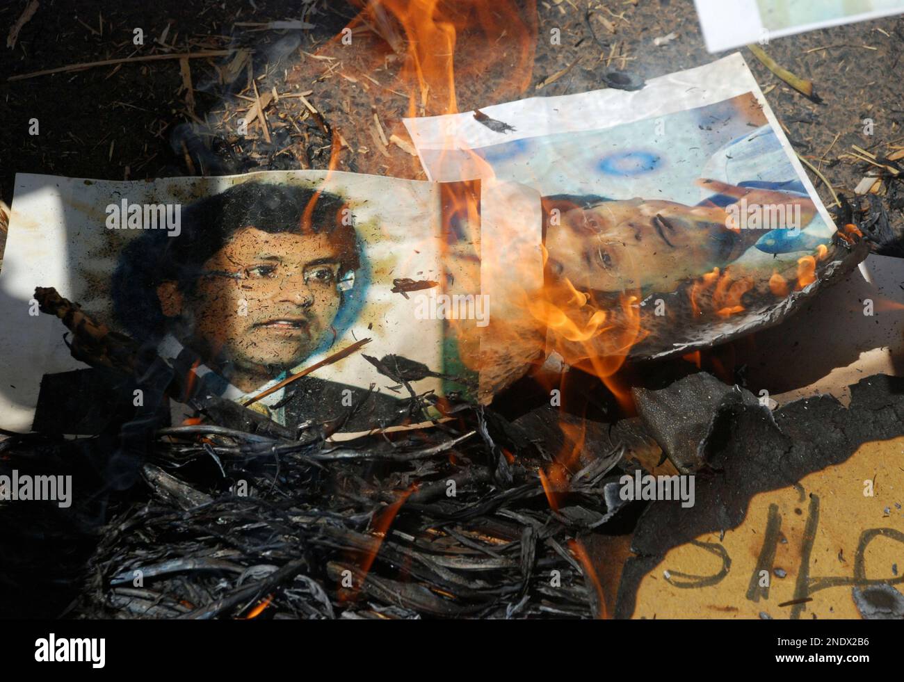 In this Saturday, April 24, 2010 file photo, posters of then Indian ...