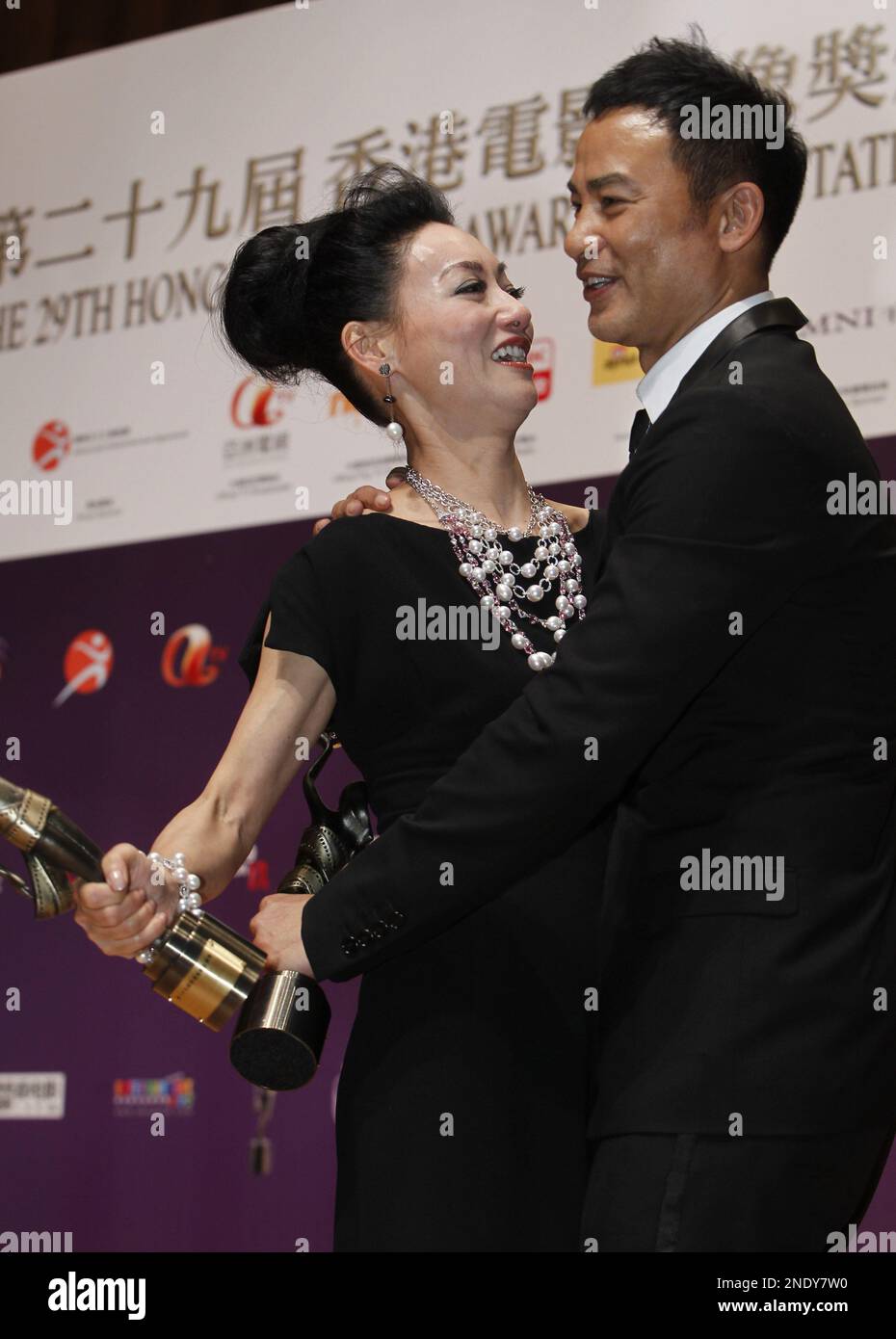 Hong Kong actress Wai Yin Hung, left, and actor Simon Yam celebrate ...