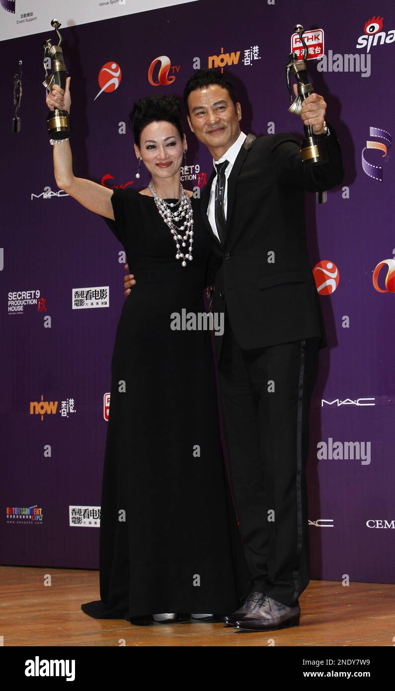 Hong Kong actress Wai Yin Hung , left, and actor Simon Yam celebrate ...