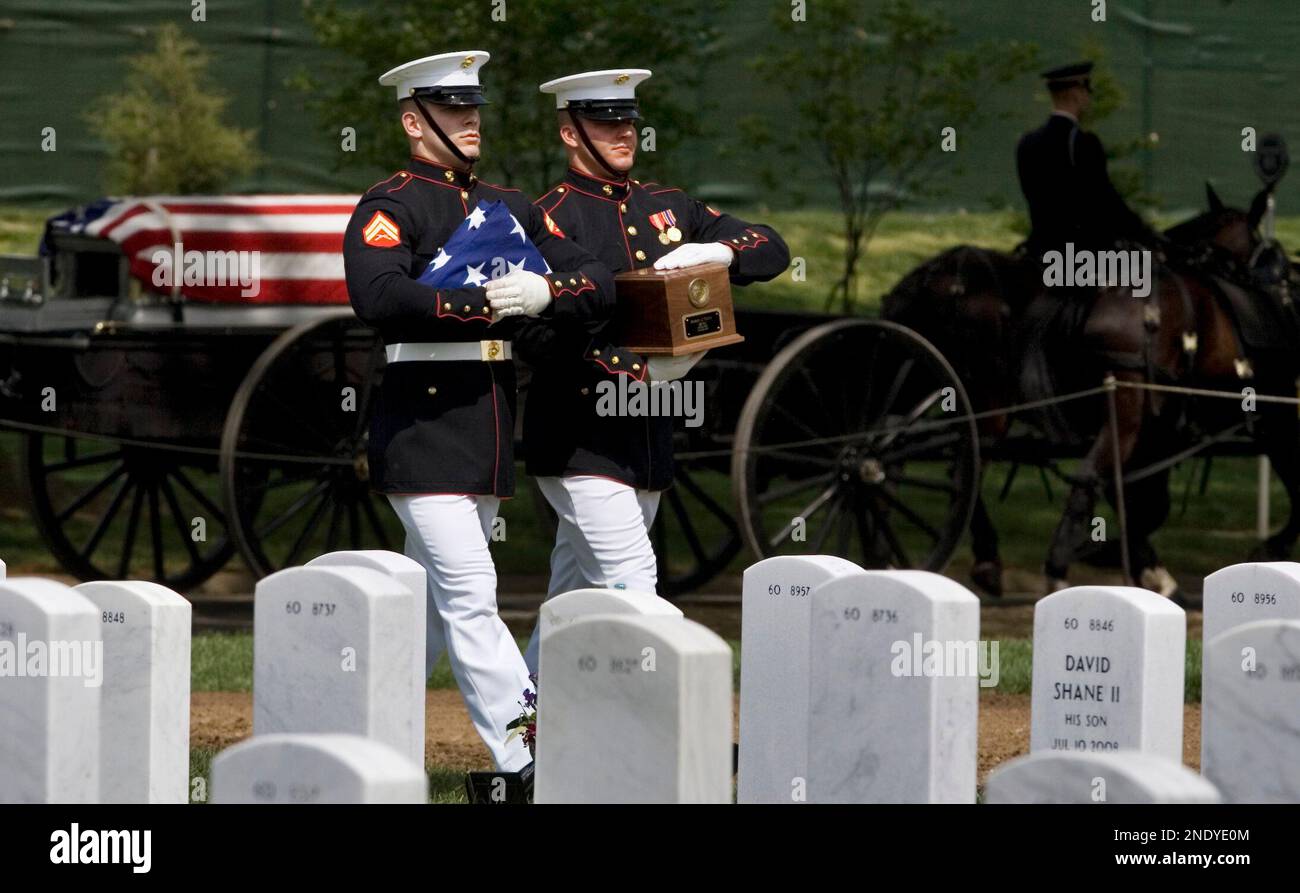 Marine honor guards carry the remains of Marine Sgt. Maj. Robert J ...