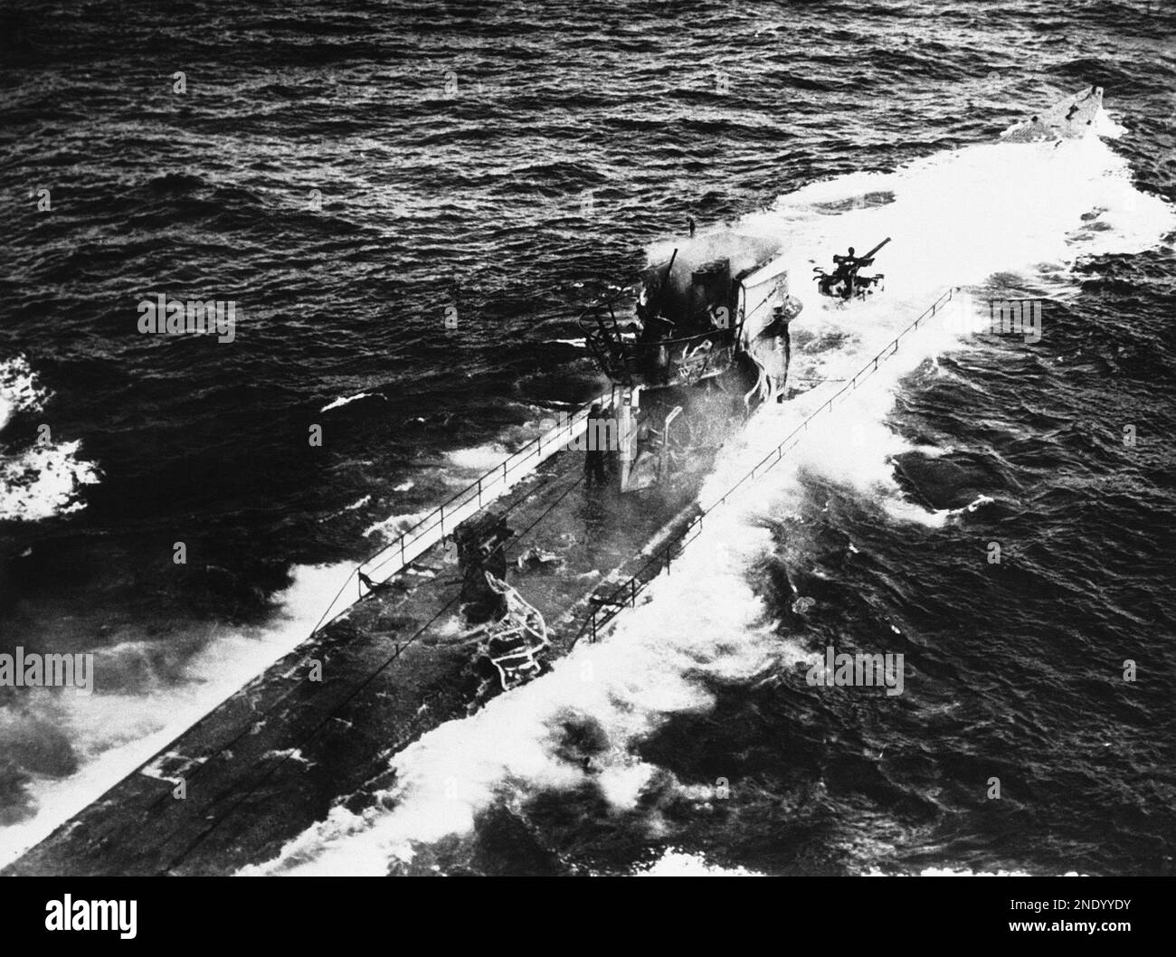 Surfacing after a depth charge attack, this Nazi submarine, which tried ...
